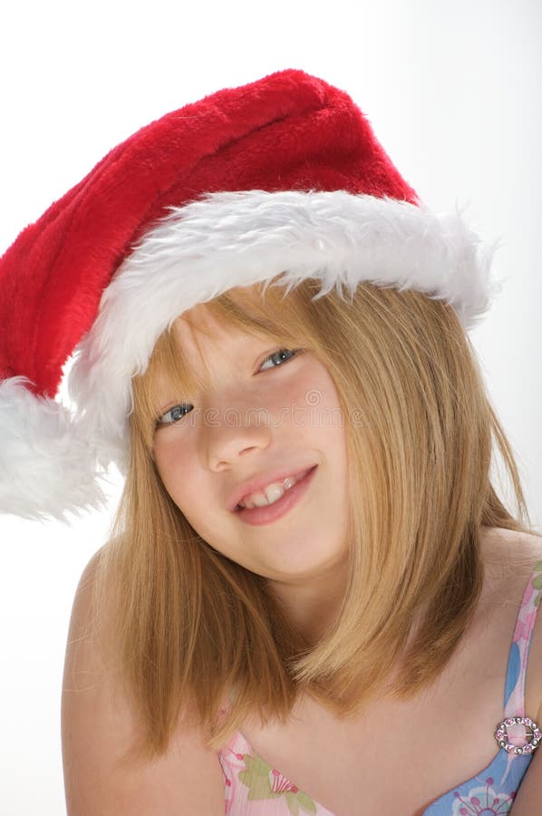 Young girl in a santa hat stock photo. Image of pretty - 16009178