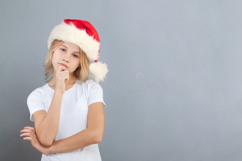 Young Girl Santa Thinking on Light Blue Background Stock Image - Image ...