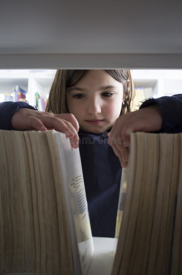 Young Girl Selecting Books from Library Bookshelf Stock Photo - Image ... Young Girl Selecting Books from Library Bookshelf Stock Photo - Image ...