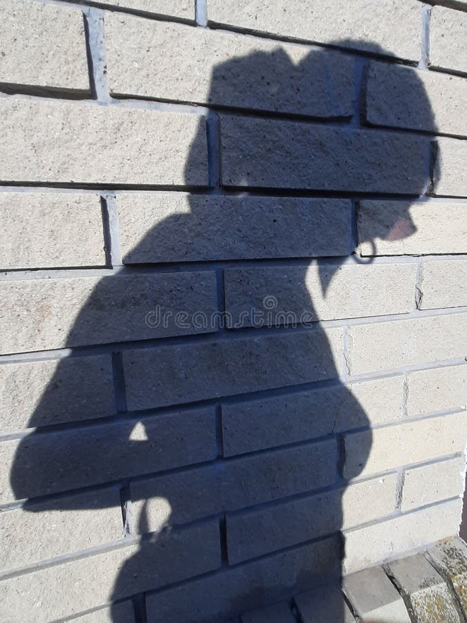 A young girl shadow stock photo. Image of blue, facade - 223259462