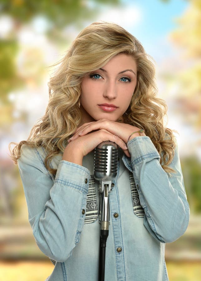 Young Girl Singer with Microphone Stock Image - Image of country, woman ...