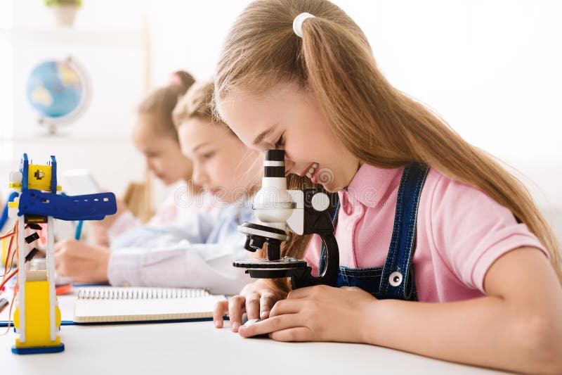 Young Girl Using Microscope during Elementary Science Class Stock Image ...