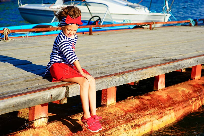 Young Girl Sitting on the Dock Stock Image - Image of friends, pier ...