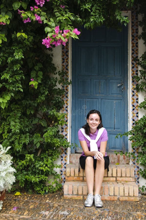Young Girl Sitting on Steps Stock Image - Image of smiling, female ...