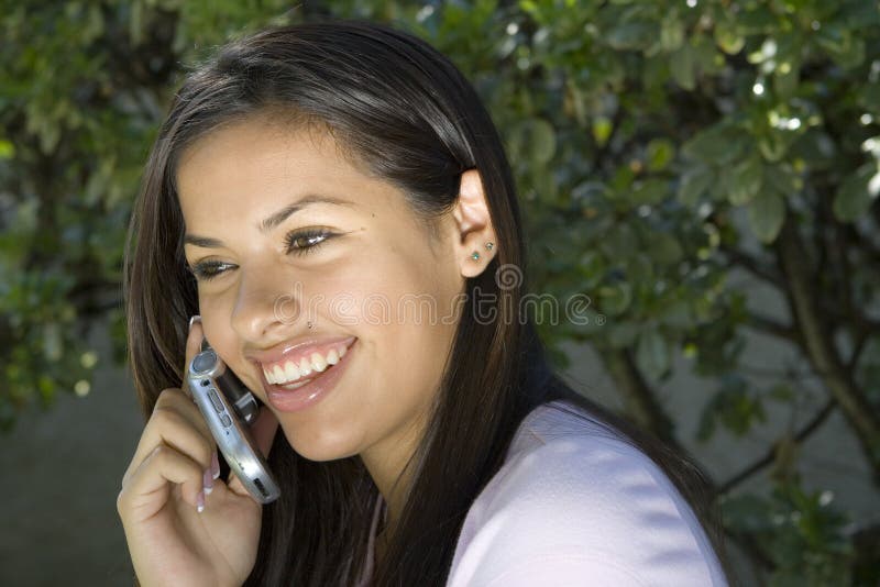 Young Girl Smiling on the Phone Stock Photo - Image of smile, smiling ...