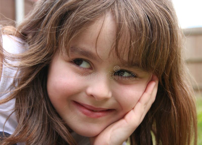 Young Girl Smiling Sideways Stock Photo - Image of posing, young: 1325702