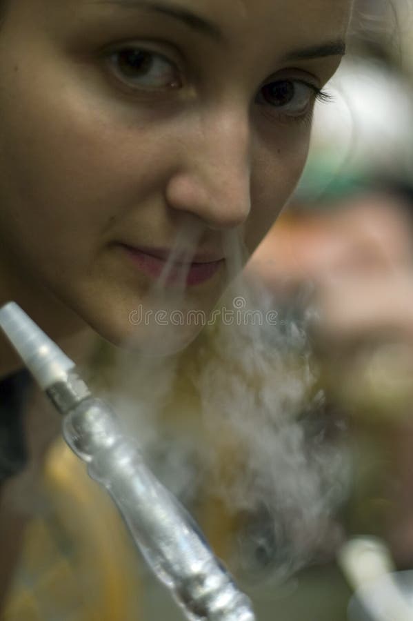 Young Girl Smoking a Nargileh Stock Image - Image of inhales, pipe: 1822049