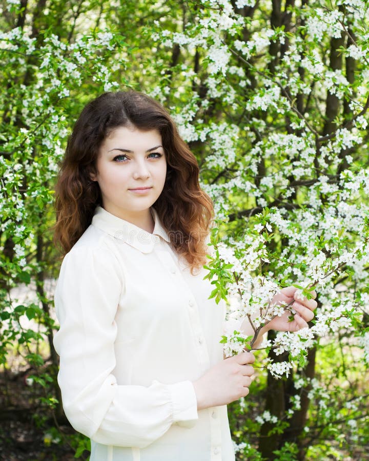 Young Girl in the Spring Garden Stock Photo - Image of flower, people ...