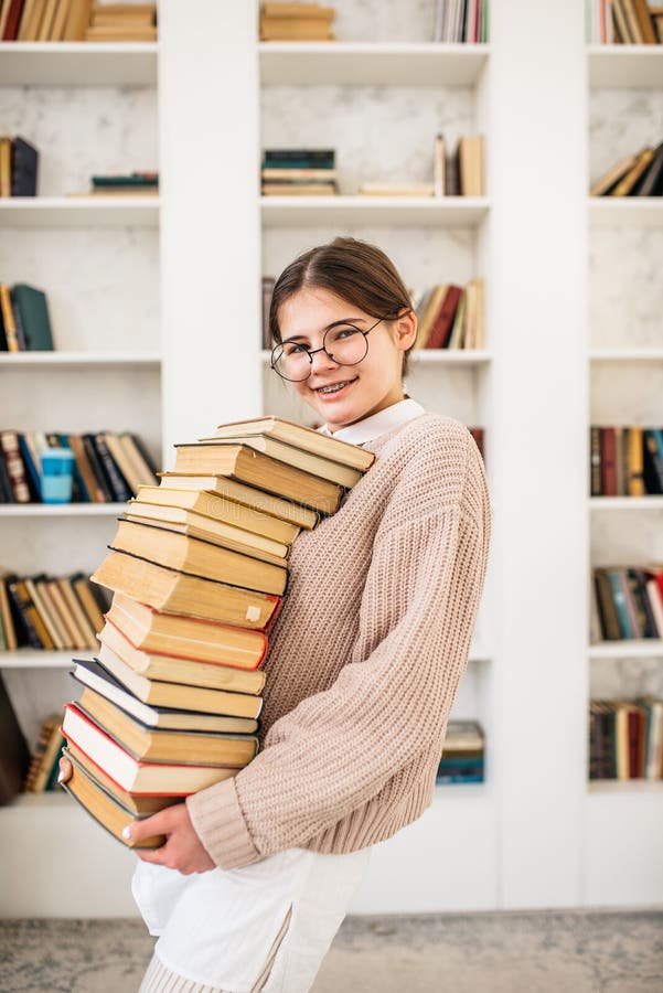 Young Girl Standing Near Bookshelf in Library Stock Photo - Image of ...