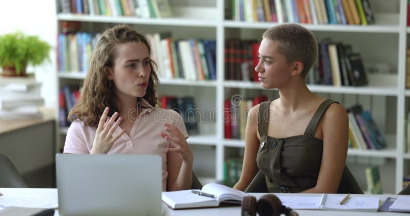 Pretty Teen Girl Studying in Library Using Laptop Stock Video - Video ...