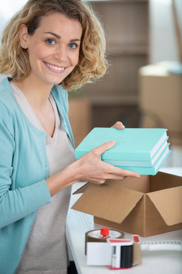 Young Girl Taking Books Out Box Stock Image - Image of mortgage ...