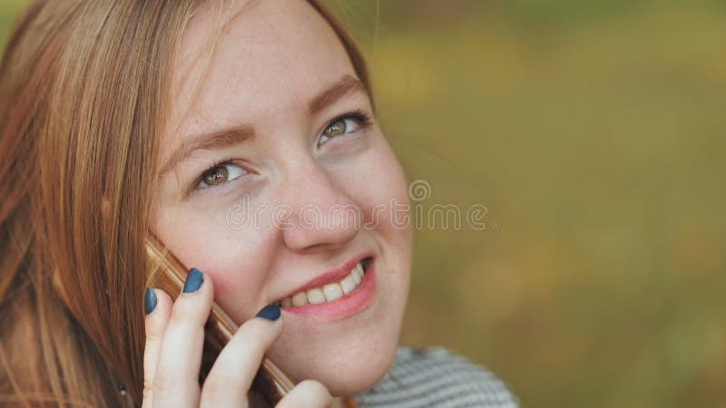 A Young Girl Talking on the Phone. Close-up of Her Face. Stock Photo ...