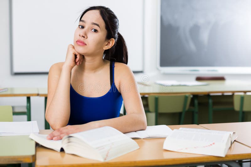 Young Girl is Thinking about Difficult Task at the Desk Stock Image ...