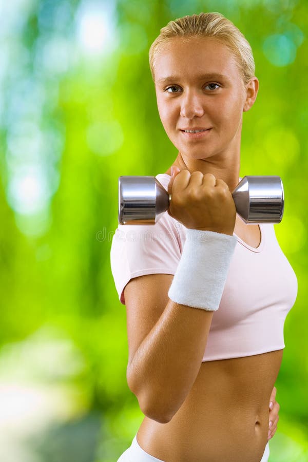 A Young Girl Training with Dambbell Stock Photo - Image of athletic ...