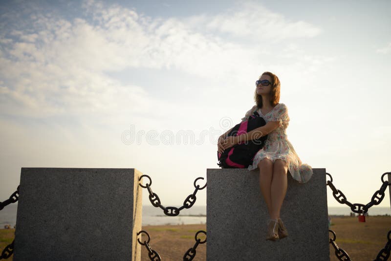 Young Girl the Traveler in a Dress and a Backpack Stock Photo - Image ...