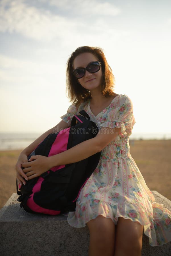 Young Girl the Traveler in a Dress and a Backpack Stock Photo - Image ...