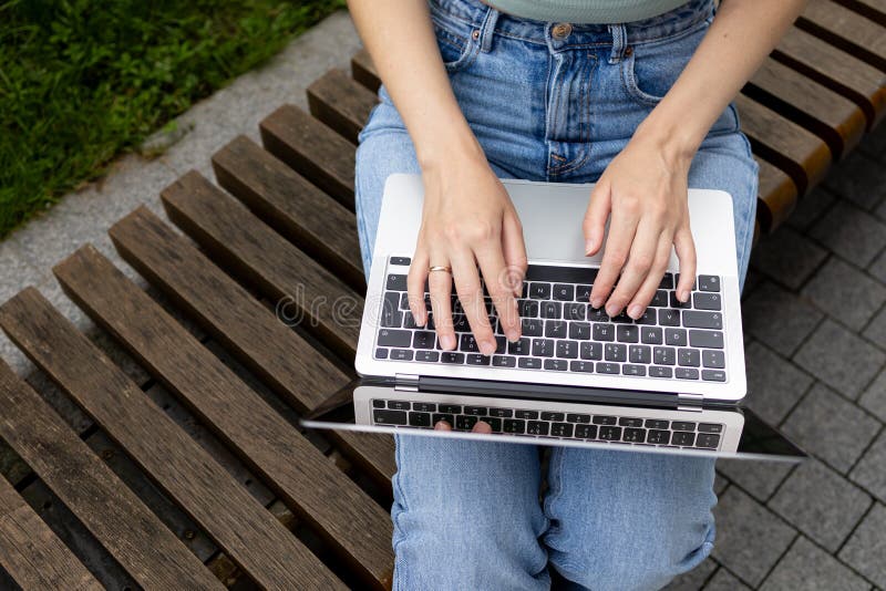A Young Girl Types on the Keyboard of a Laptop, Computer. Stock Image ...
