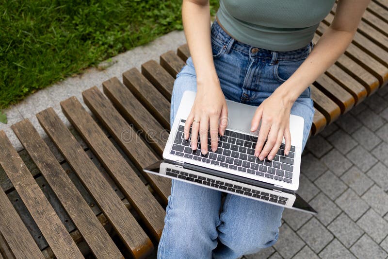A Young Girl Types on the Keyboard of a Laptop, Computer. Stock Image ...