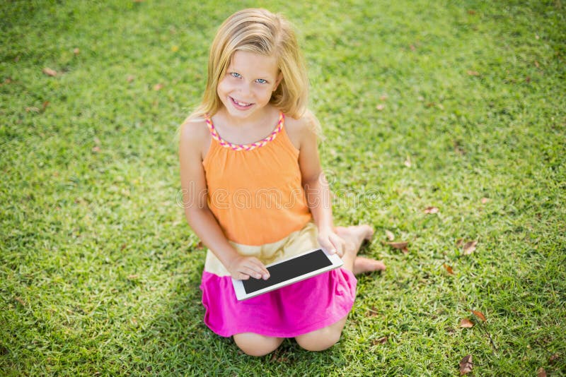 Young Girl Using Digital Tablet in Park Stock Photo - Image of internet ...