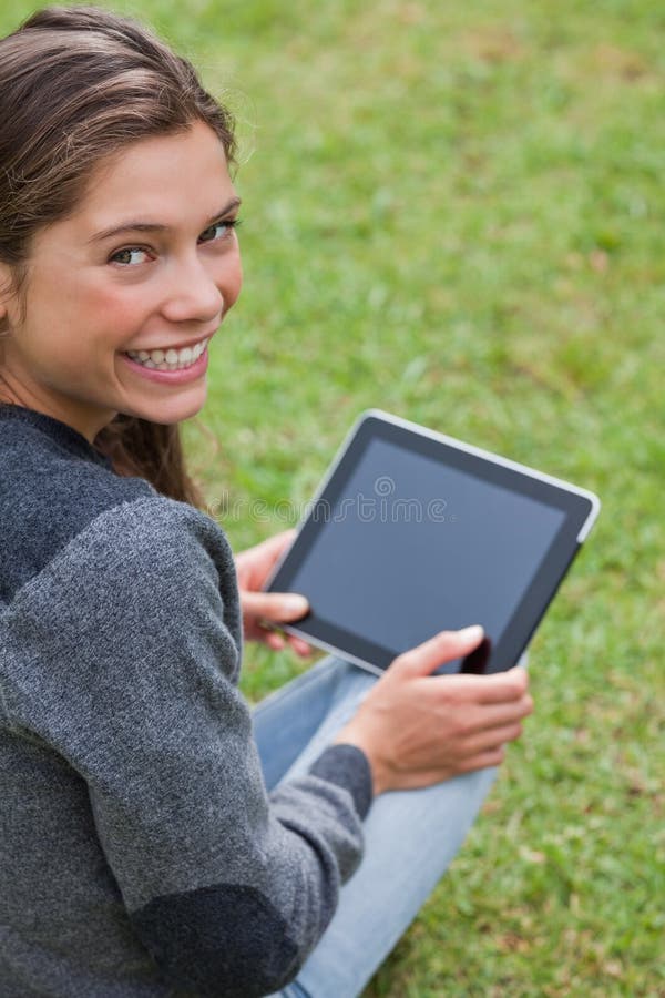 Young Girl Using Her Tablet Pc Stock Image - Image of crossed, hair ...