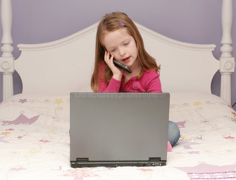 Young girl using a laptop stock image. Image of girl - 12921505
