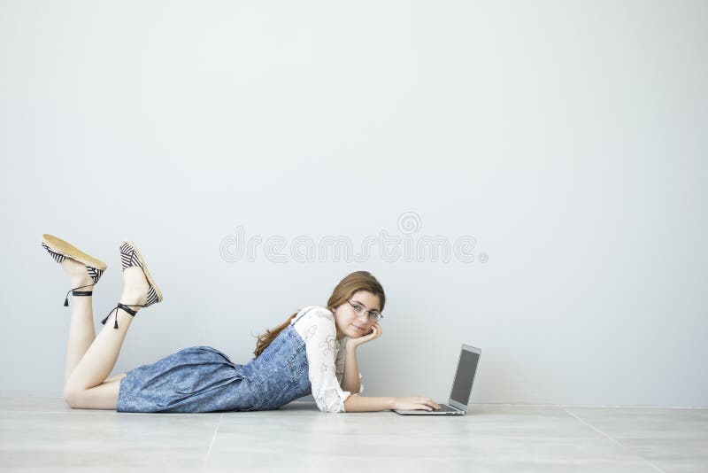 Young Girl Using Laptop on Floor Stock Photo - Image of chatting, girl ...