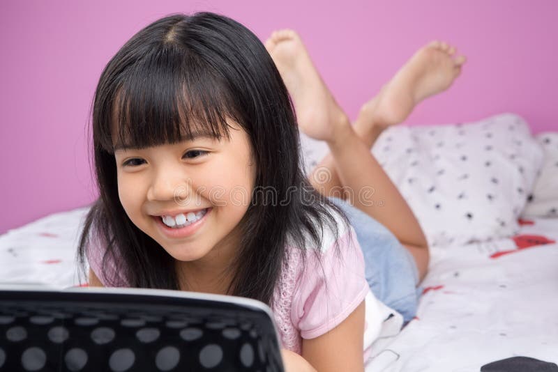 Young Girl Using Laptop in Her Bedroom Stock Image - Image of cute ...