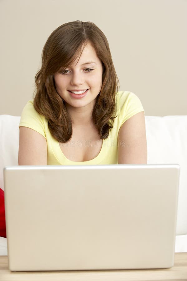 Young Girl Using Laptop at Home Stock Image - Image of home, browsing ...