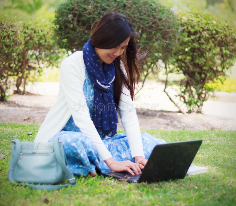 Young girl using laptop stock photo. Image of pretty - 53293810