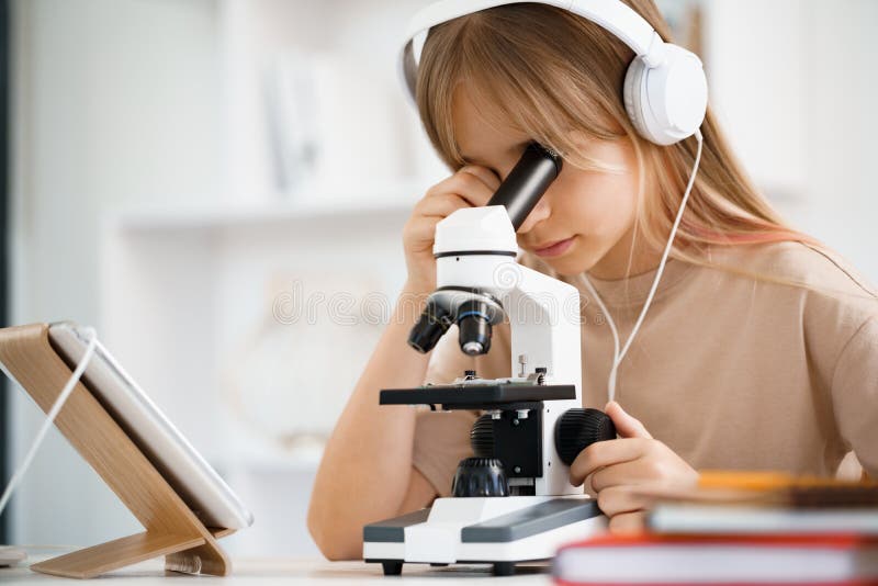 Young Girl Using Microscope during Online Lesson Education at Home ...