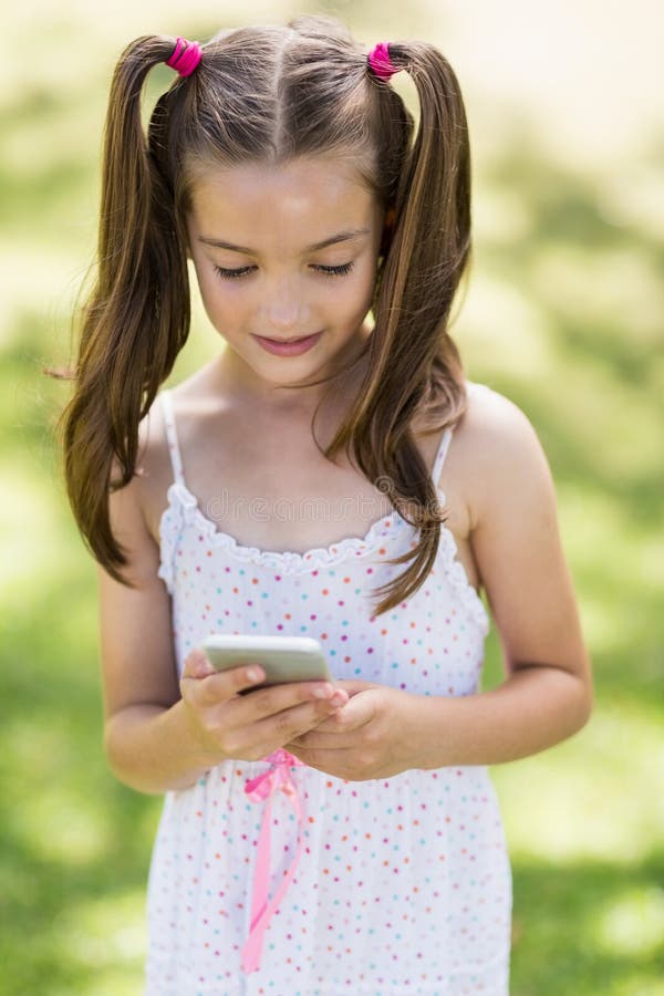 Young Girl Using Mobile Phone Stock Photo - Image of multiethnic ...