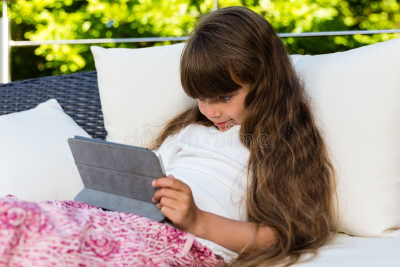Young girl using tablet stock image. Image of long, smiling - 42029067