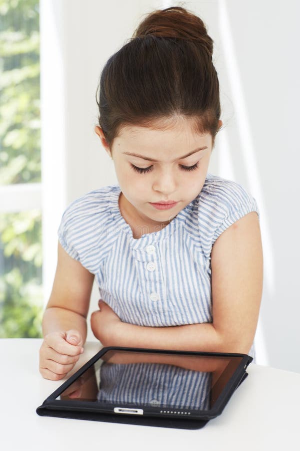 Young girl using tablet stock image. Image of brunette - 39811555