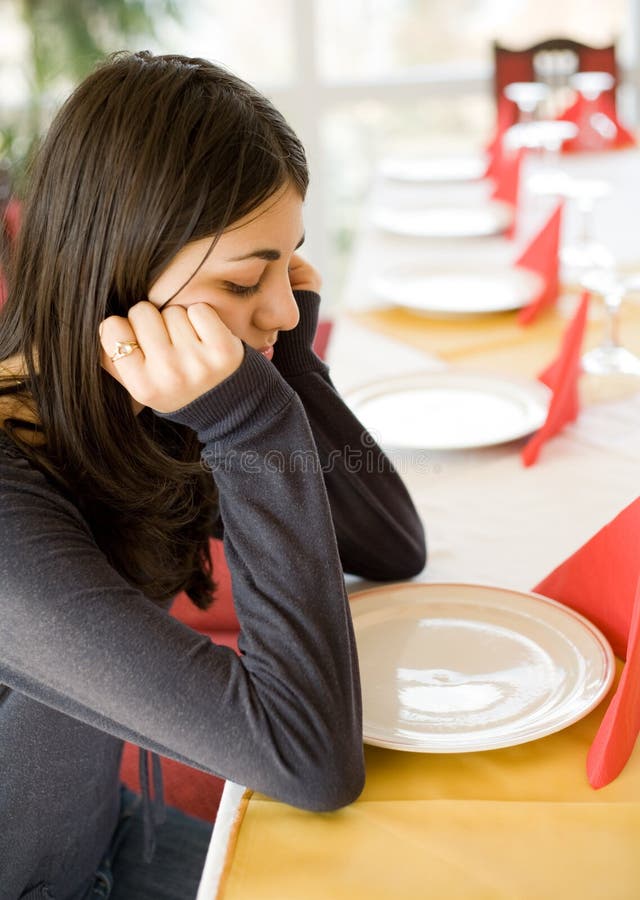 Young Girl Waiting in a Restaurant Stock Image - Image of girl, glasses ...