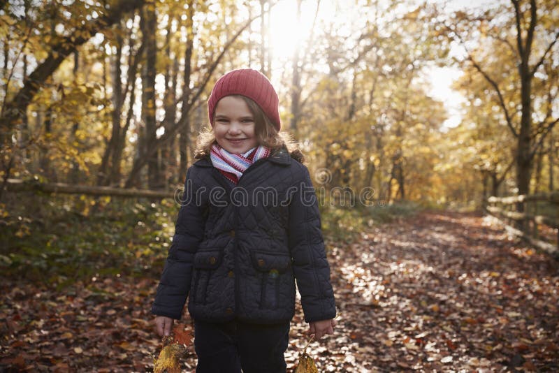 Young Girl Walking Along Path through Autumn Countryside Stock Image ...