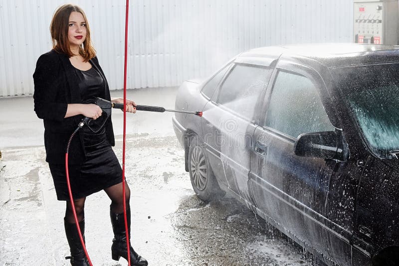 Young girl washes the car stock photo. Image of station - 90207622