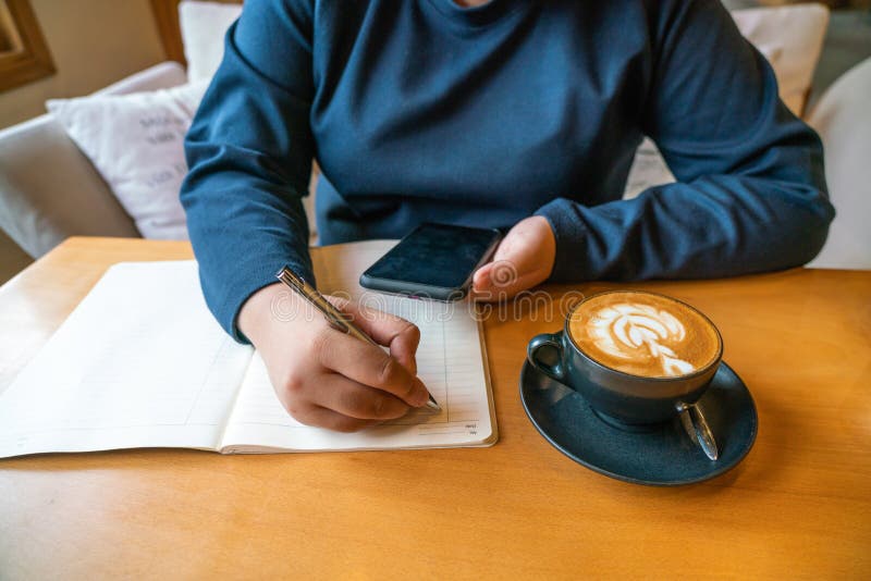 Watching Phone and Writing Notes Stock Image - Image of paper, desk ...