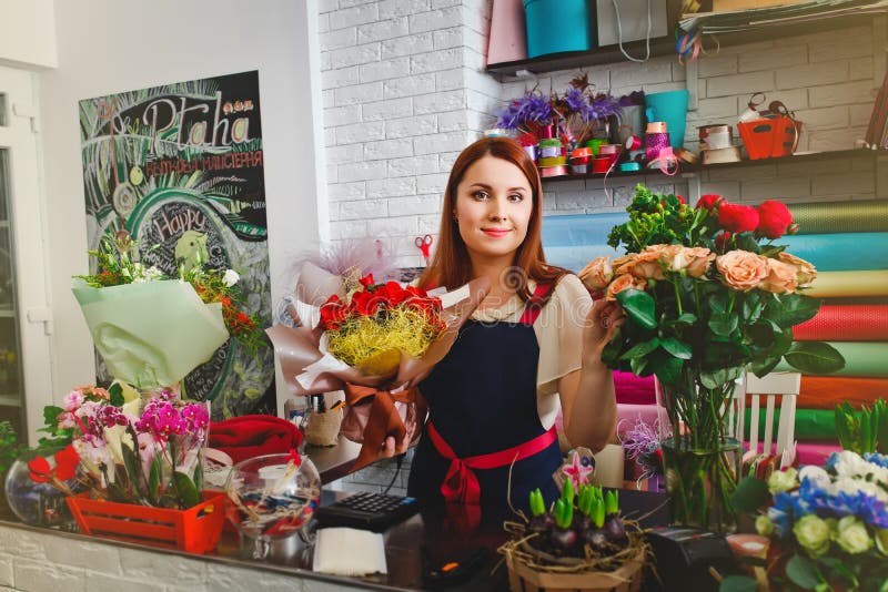 Young Girl Working in a Flower Shop, Florist Woman Makes a Bouquet ...