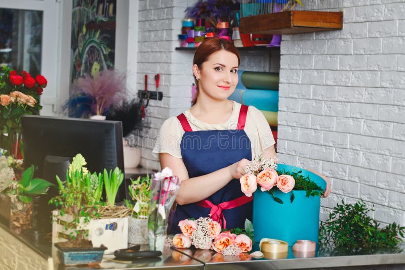 Young Girl Working in a Flower Shop, Florist Woman Makes a Bouquet ...