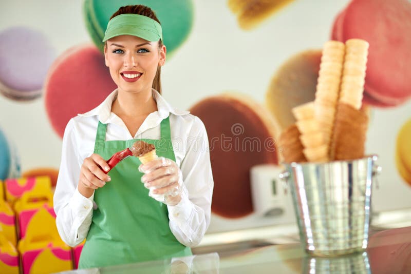 Young Shopkeeper at Work Selling Sweets To Customer Stock Image - Image ...