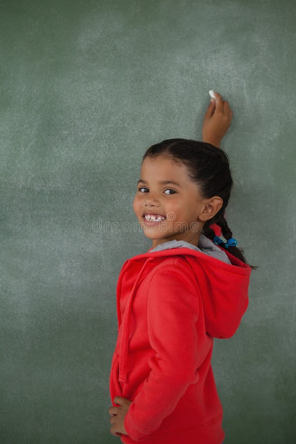 Young Girl Writing on Chalk Board Stock Photo - Image of learning ...