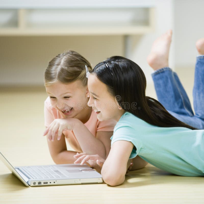 Young Girls on a Computer stock image. Image of notebook - 3313481