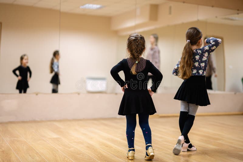 Young Girls at Dance Class Practicing Ballet and Dance Moves in Studio ...