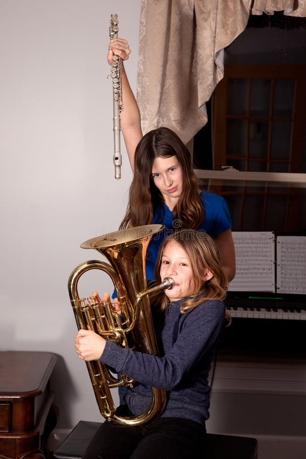 Young Girls with Instruments Stock Photo - Image of playing, performing ...