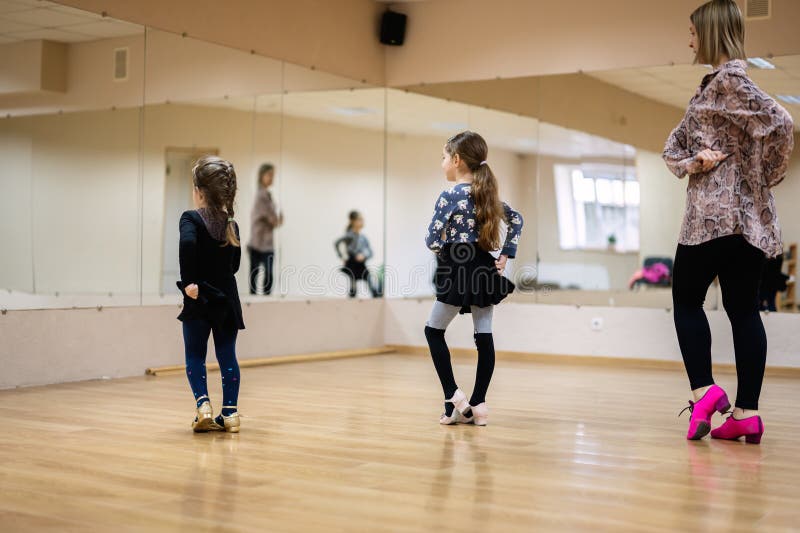 Young Girls Learning Dance in Studio with Female Instructor Stock Photo - Image of girls ...
