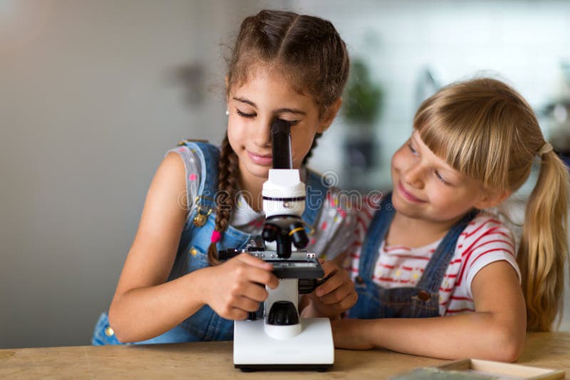 Kids Doing Experiment on Microscope in Laboratory Stock Image - Image ...