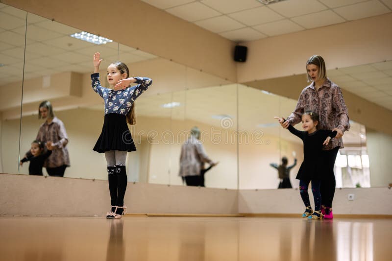 Young Girls Practicing Ballet with Instructor in Dance Studio Stock ...