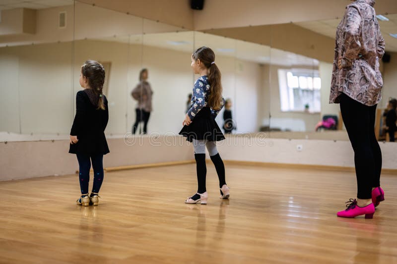 Young Girls Practicing Dance in Studio with Instructor Stock Photo ...
