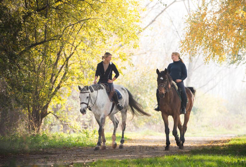 Girls on horseback riding stock image. Image of leaves - 40309121