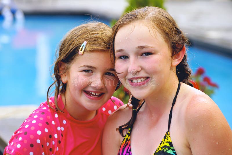 Young Girls Smiling at Pool Side Stock Photo - Image of young, summer ...